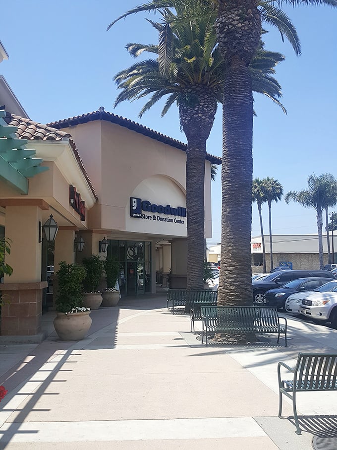The Spanish-inspired entrance welcomes bargain hunters on sun-drenched California days. Those benches outside are for partners waiting patiently.