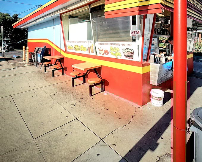The exterior view shows Donut Hut in its natural habitat—a neighborhood institution that doesn't need to shout to be heard.