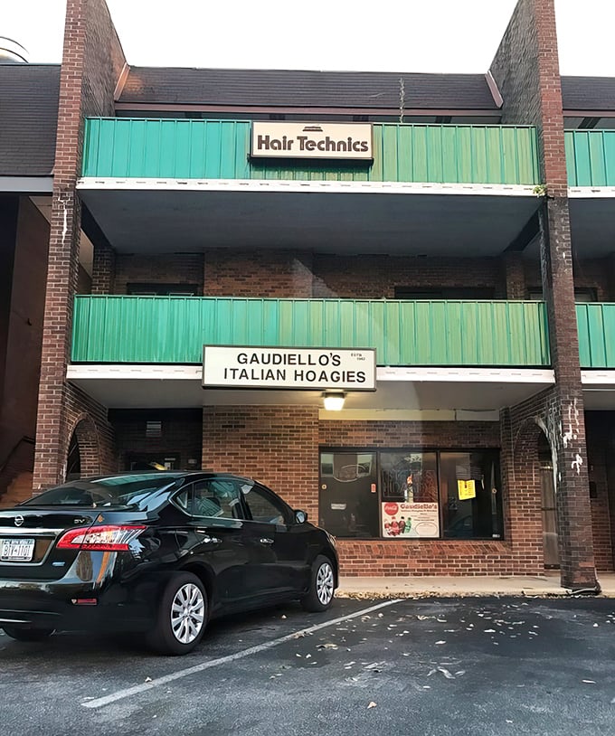 The unassuming storefront of Gaudiello's nestled in Trolley Square Shopping Center – proof that culinary treasures often hide in plain sight beneath turquoise awnings.