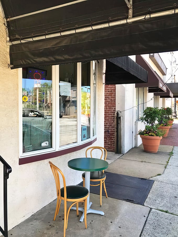 Sidewalk seating for when the weather's right. A green table and bentwood chairs – diner simplicity at its finest.