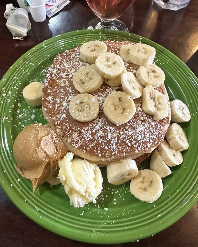 Pancakes that make you want to write poetry. The bananas and powdered sugar aren't just toppings—they're exclamation points at the end of a delicious sentence.