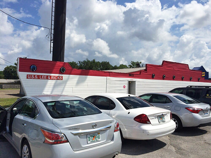 The parking lot view reveals the truth—this unassuming vessel-shaped building draws a loyal fleet of cars filled with people who know where real flavor docks.