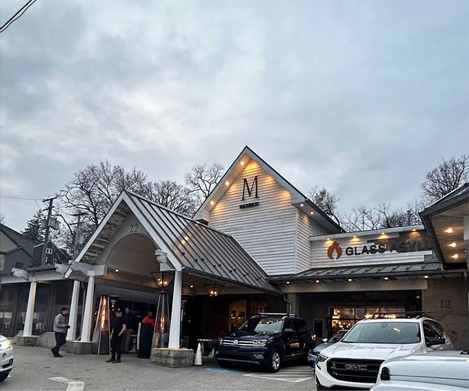 As dusk falls, M Italian's illuminated exterior transforms into a glowing invitation – promising culinary comfort to those wise enough to have made reservations.