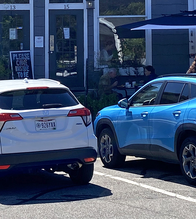 Even the parking lot offers a view of happy diners enjoying their meals on the patio—breakfast with a side of fresh air.