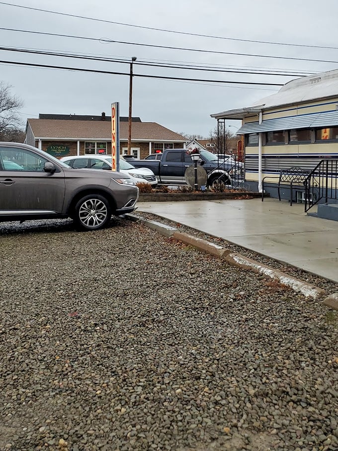 Even the parking area tells a story—gravel crunching under tires as hungry patrons arrive, knowing comfort food awaits just steps away.