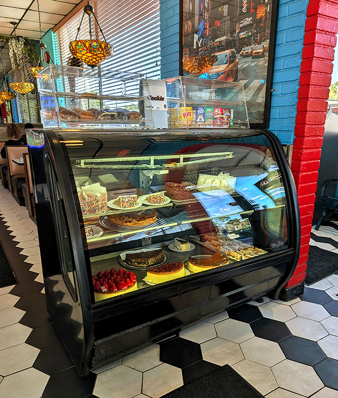 The dessert case – where willpower goes to surrender. Each shelf a different chapter in the story of "I shouldn't, but I will."