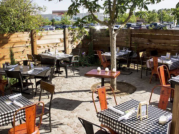 Outdoor patio dining extends the experience under California skies – al fresco barbecue bliss with checkered table charm.