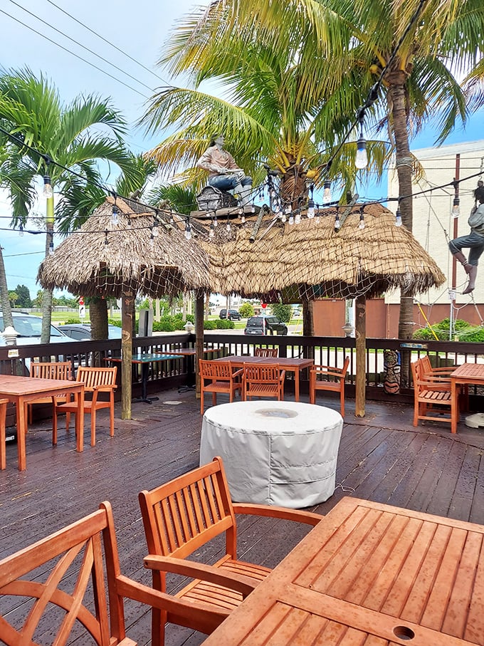 The outdoor patio offers a slice of tropical paradise – palm trees included, no passport required.
