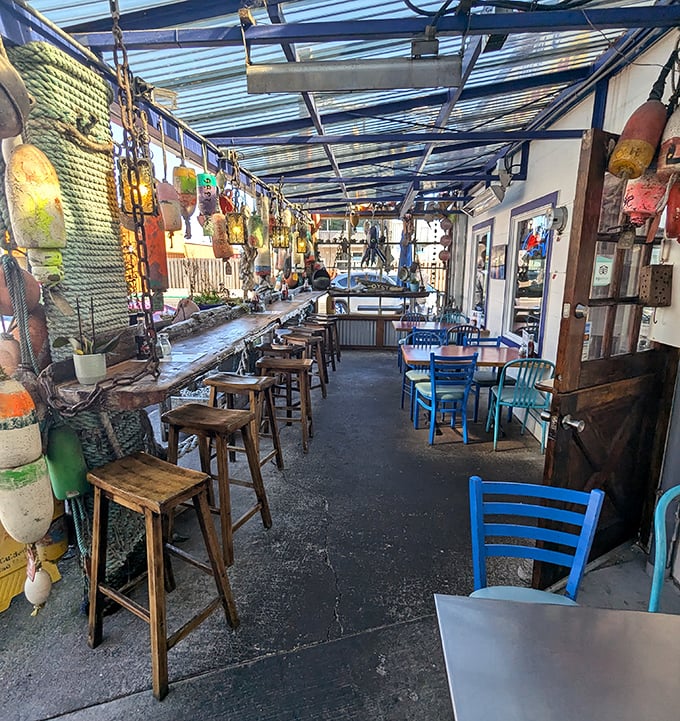 The covered patio dining area dangles with buoys and fishing floats that have retired from sea duty to become the most authentic restaurant decorations imaginable.