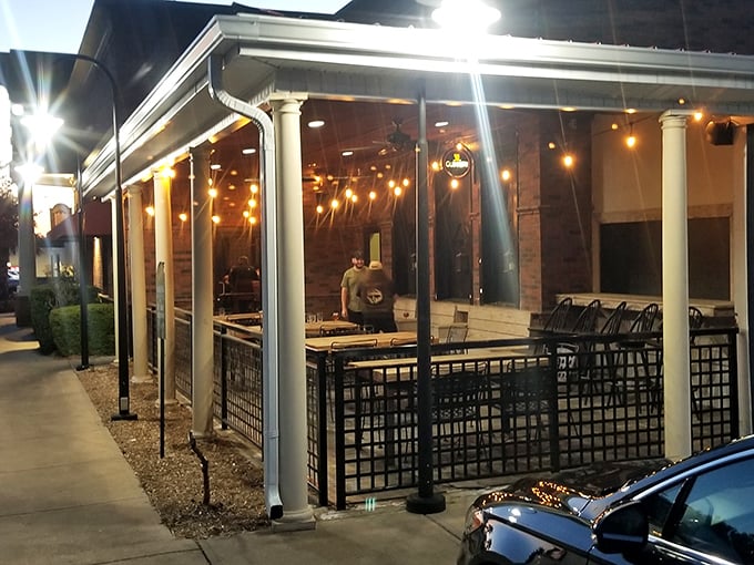 The patio at night transforms into a twinkling sanctuary where summer evenings stretch deliciously into night over unhurried conversations.
