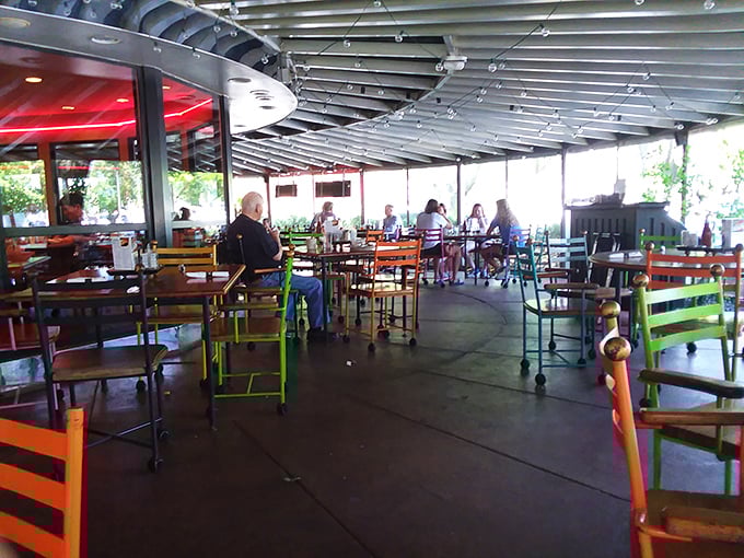 The outdoor patio with its colorful chairs feels like dining in a Crayola box – a cheerful spot to people-watch while your milkshake melts.