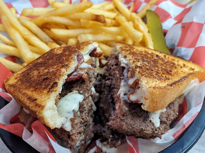 The patty melt reveals its soul—perfectly grilled bread embracing a beef patty and melted cheese in a sandwich that means business.