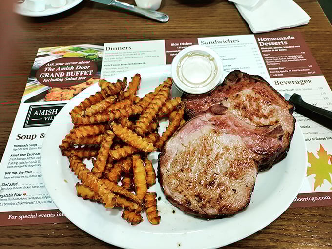 A pork chop and crinkle fries that would make a vegetarian question their life choices. That meat isn't just cooked—it's been persuaded to perfection.