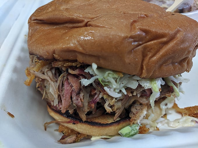 This pulled pork sandwich isn't just lunch—it's an engineering marvel of meat-to-bun ratio that somehow stays intact until the last bite.