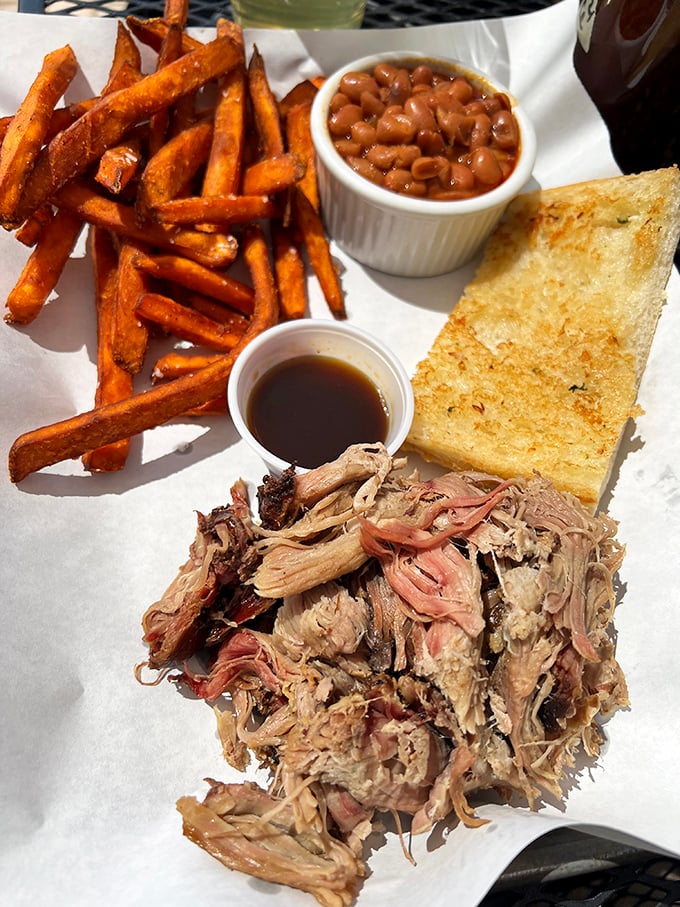 The pulled pork sandwich that launched a thousand road trips. Worth driving across state lines for—just ask the license plates in the parking lot. 