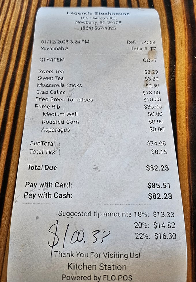The receipt tells the true story – prime rib, roasted corn, and sweet tea. A Southern trilogy that explains why everyone's smiling at the next table.