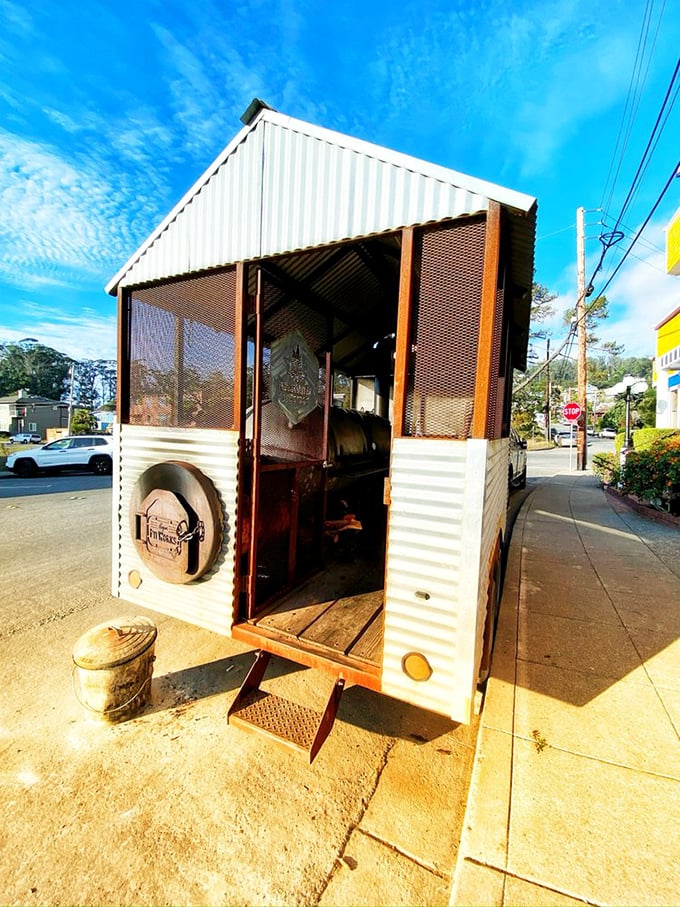 This custom smoker is where the magic happens—a humble-looking metal shed that transforms ordinary cuts into extraordinary barbecue.