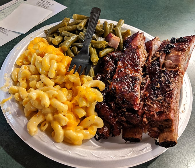 Ribs with the perfect pull—not falling off the bone (that's overcooked) but surrendering with just the right resistance. The mac and cheese isn't bad either.