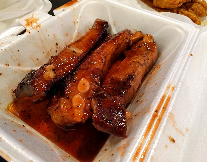 These ribs aren't just falling off the bone—they're practically jumping into your mouth, glazed with a sauce worth bottling and selling.