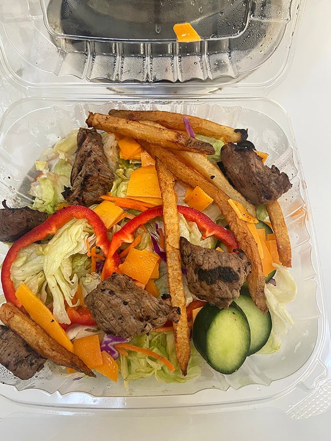 A salad that doesn't apologize for being healthy – those fries are just there to make the transition to vegetables less traumatic.