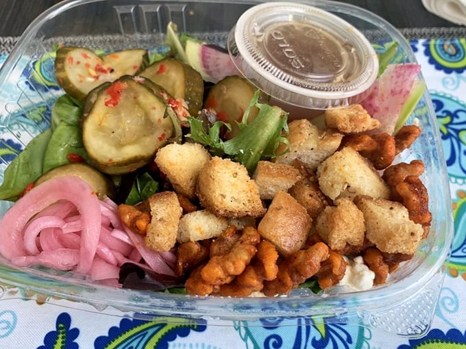 A salad that doesn't apologize for being delicious – pickled onions, crunchy croutons and colorful vegetables that make eating greens a pleasure.