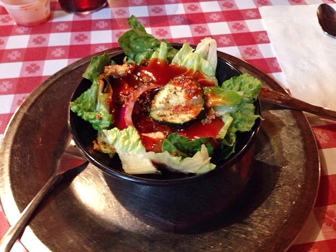 A garden salad that somehow feels indulgent—because even at a temple of comfort food, there's room for token vegetables swimming in delicious dressing.