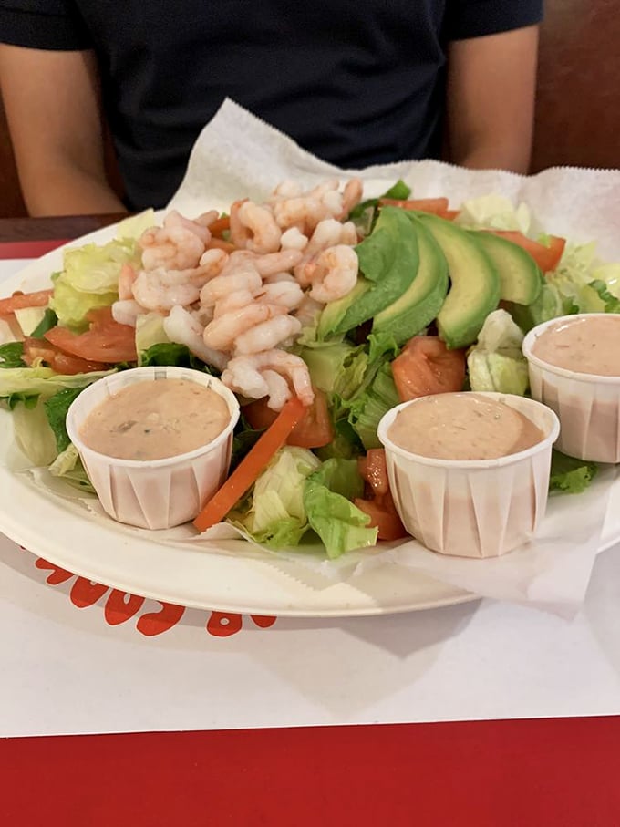 A salad that doesn't apologize for being healthy—plump shrimp, creamy avocado, and fresh vegetables with not one but three dressing cups for maximum dipping potential.
