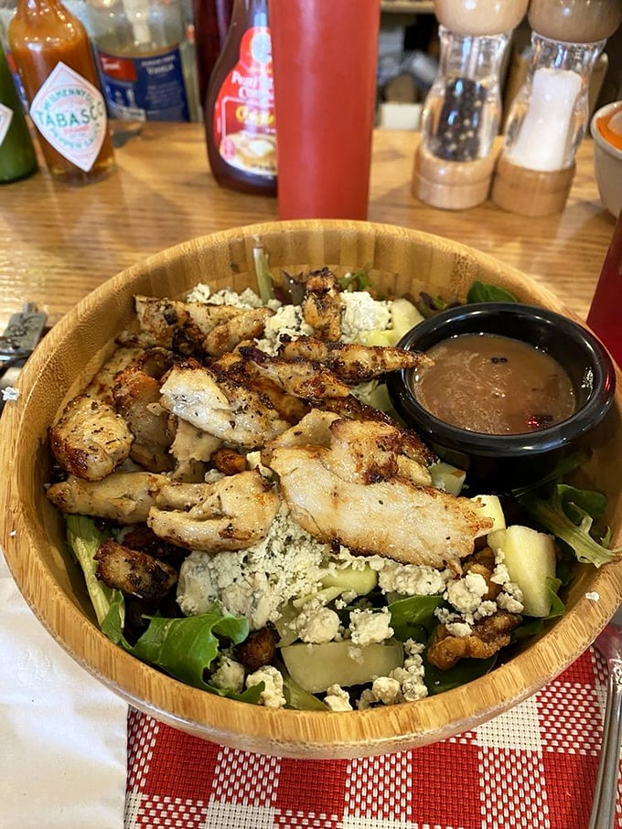 This salad bowl proves healthy eating needn't be punishment—grilled chicken, fresh greens, and goat cheese create a virtuous indulgence worth savoring.