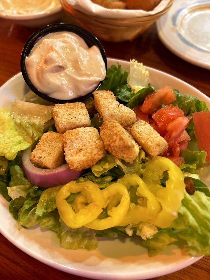 A garden-fresh salad that doesn't apologize for being the opening act to seafood stardom – crisp, colorful, and dressed to impress.