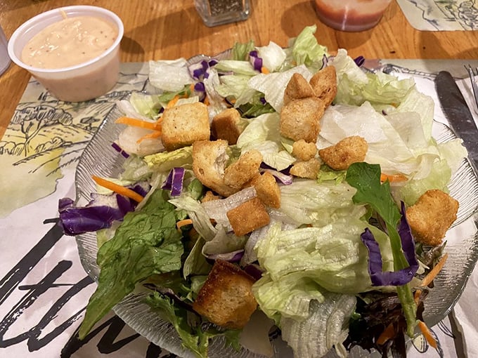 A simple salad becomes something special with homemade dressing—proof that even the supporting actors deserve applause in a great meal.