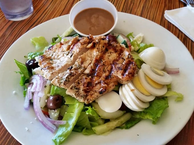 This salad isn't just playing defense against calories—it's a vibrant celebration of grilled chicken, fresh greens, and eggs that deserve their own parade.