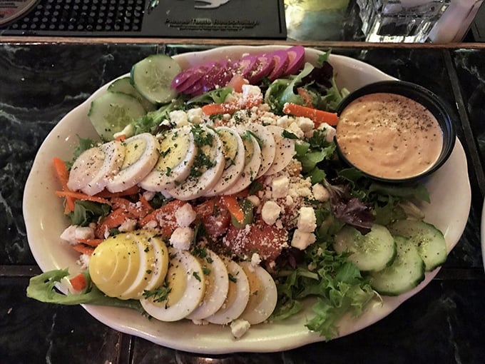 A salad that actually excites – fresh greens playing host to a party of hard-boiled eggs, veggies, and cheese that makes "eating healthy" feel like cheating.