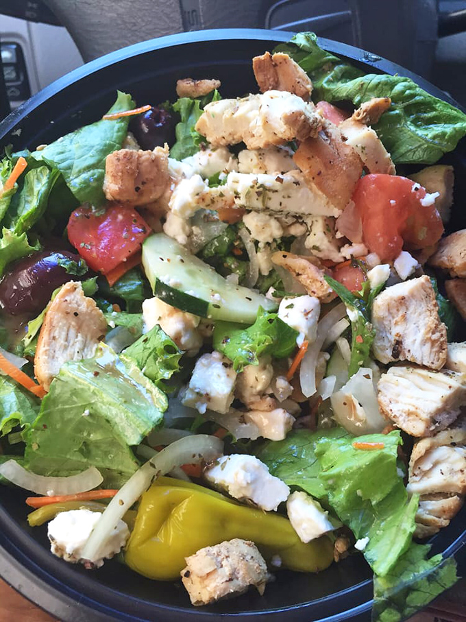 This salad isn't what you came for, but it might be what converts you—fresh ingredients proving Olympic isn't just about bread-based brilliance.