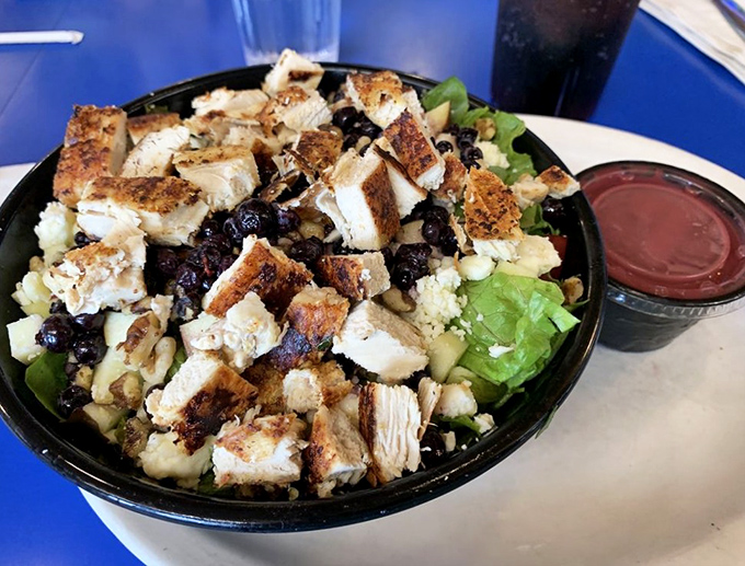 A symphony of textures—grilled chicken, dried berries, and crunchy nuts atop fresh greens. Proof that Betty's isn't just about the sweet stuff.