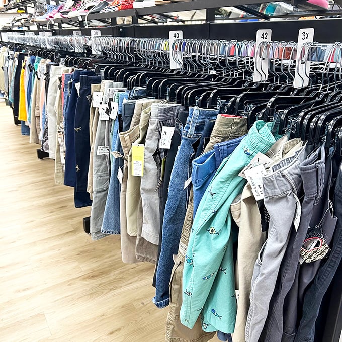 A denim rainbow organized by size—the thrift store equivalent of finding the pot of gold without having to chase the leprechaun.
