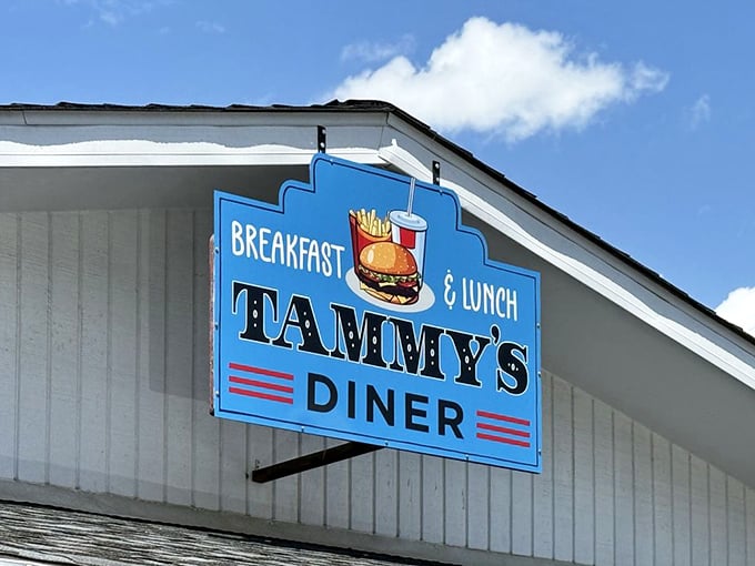 That blue sign against white clapboard—like a beacon calling to hungry travelers and locals alike. Simplicity never goes out of style.