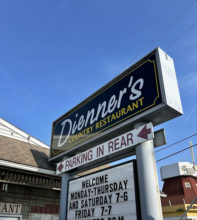 The iconic sign glows like a beacon for hungry travelers. By day or night, it promises comfort and satisfaction.
