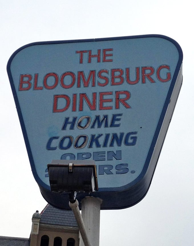 The retro sign promises "HOME COOKING" – four syllables that speak volumes about what awaits inside.