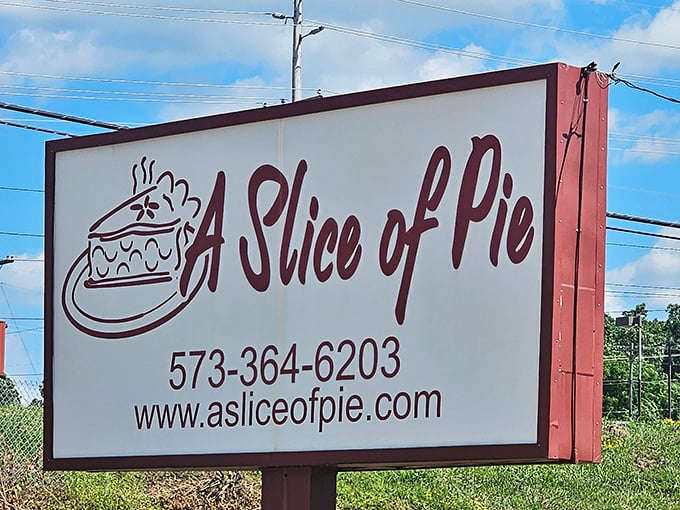The roadside sign stands as a simple promise to travelers: extraordinary pie experiences await just off the highway.