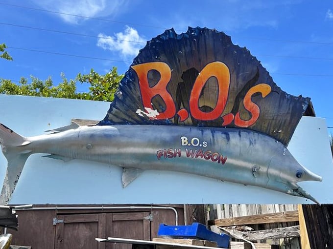 The sign says it all—part fish, part art, all B.O.'s. This metallic marlin has guided more hungry souls than any lighthouse.
