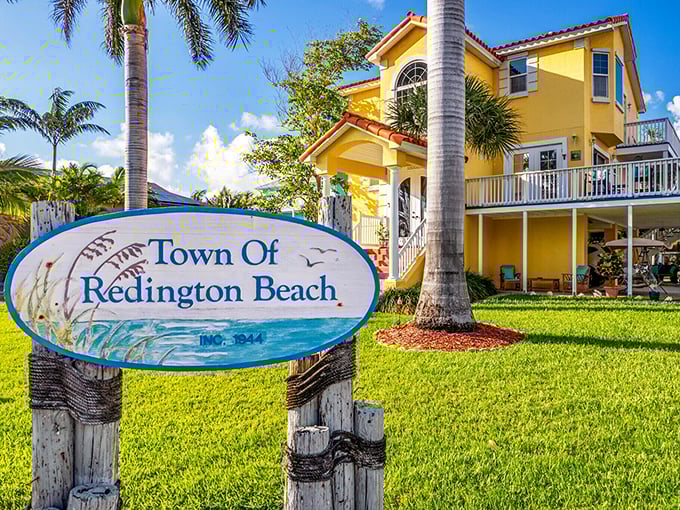 The town sign that says "established 1944" reminds us that even paradise has paperwork. A cheerful yellow welcome to a slice of Florida history.