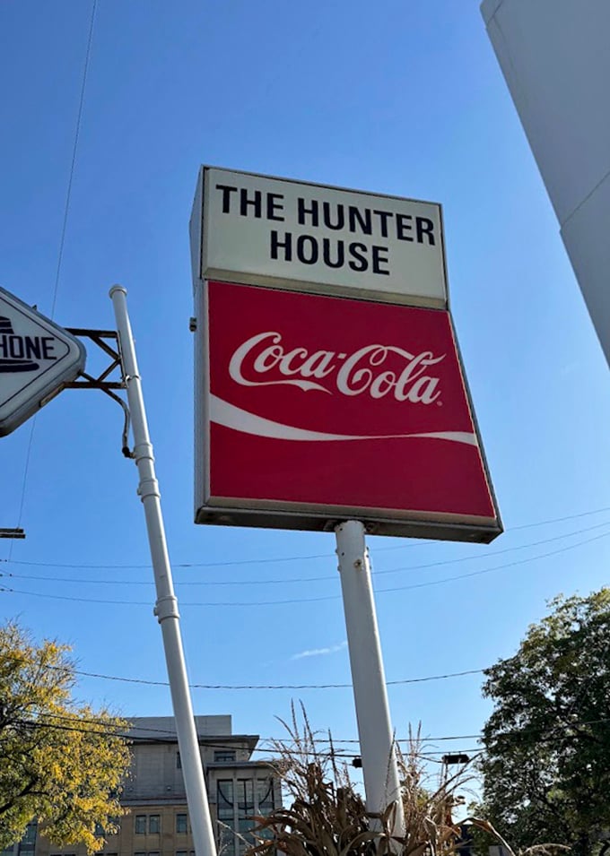 The classic sign stands tall against Michigan's blue sky—a landmark that's guided hungry travelers for decades.