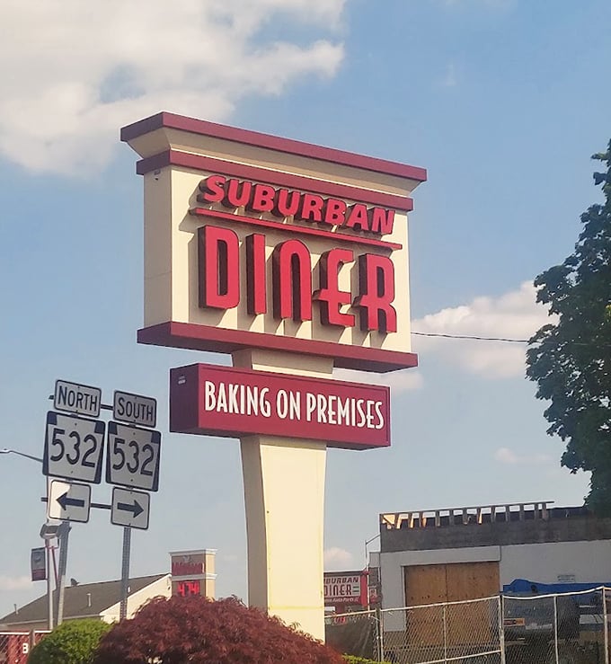 That sign against blue sky – a beacon of hope for hungry travelers and a landmark for locals seeking comfort food salvation.