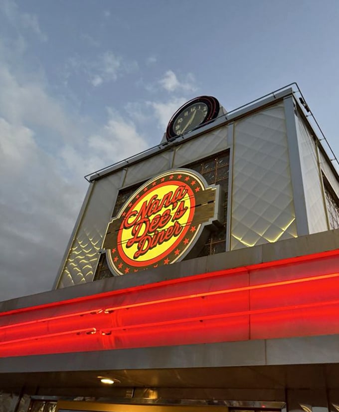 As dusk falls, Nana Dee's neon sign glows like a lighthouse guiding hungry travelers to a safe harbor of comfort food.