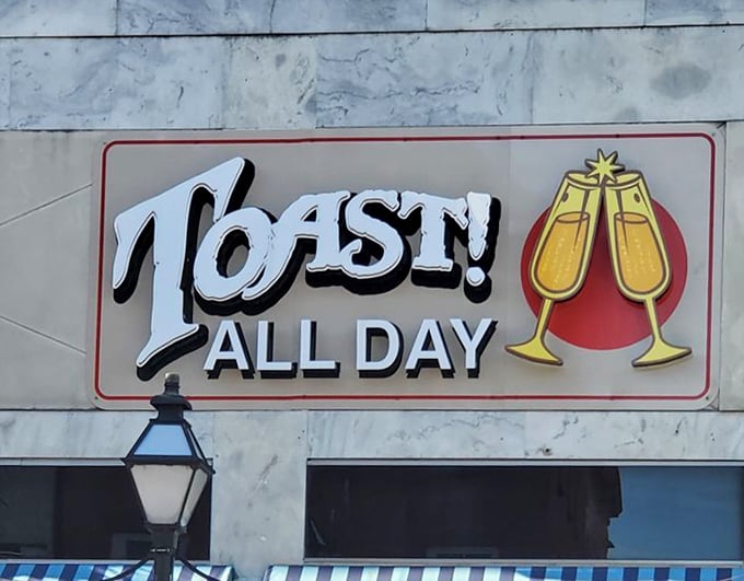 The sign says it all – a celebration in two champagne glasses, promising toasts and good times from sunrise to well past noon.
