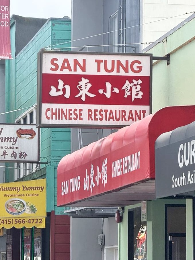 The iconic San Tung sign beckons hungry pilgrims like a lighthouse guiding ships to safe harbor. Follow the red glow to flavor town.