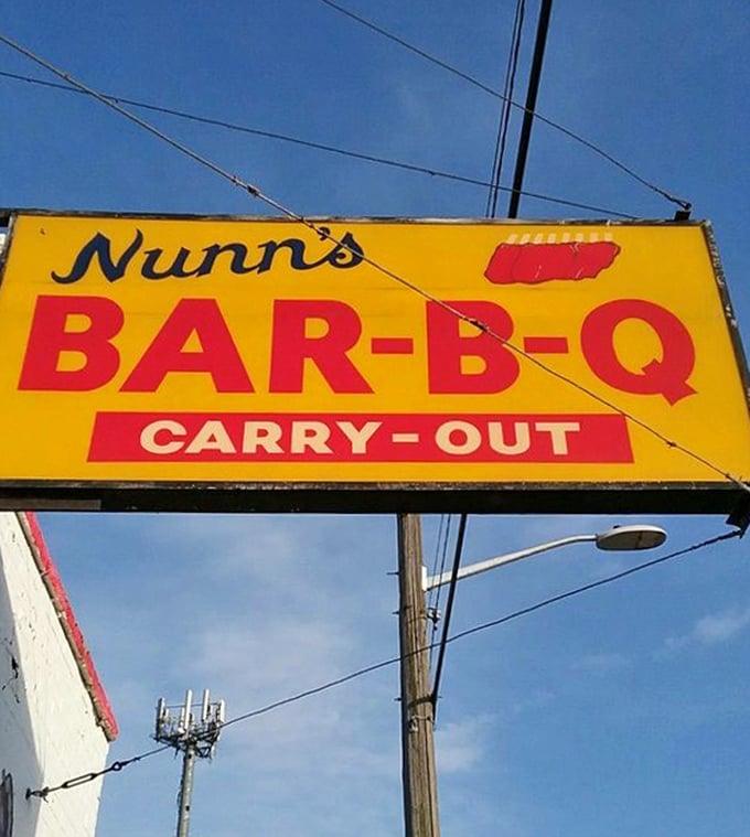 That yellow sign against the blue Detroit sky—like a beacon of barbecue hope for hungry souls in need of comfort food salvation.