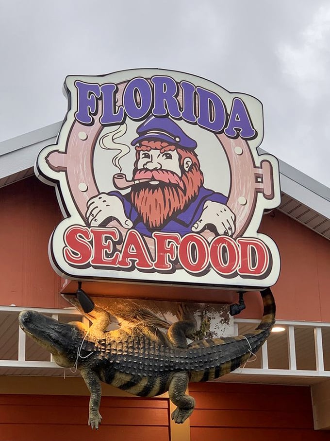 The restaurant's mascot—a bearded sea captain with a pipe—watches over an alligator guardian. Only in Florida could this combination seem perfectly logical.