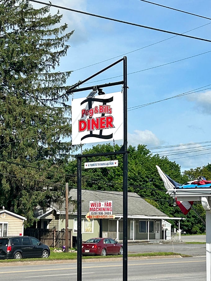 The sign stands tall like a beacon of breakfast hope along the roadside—a landmark for hungry travelers and locals alike.