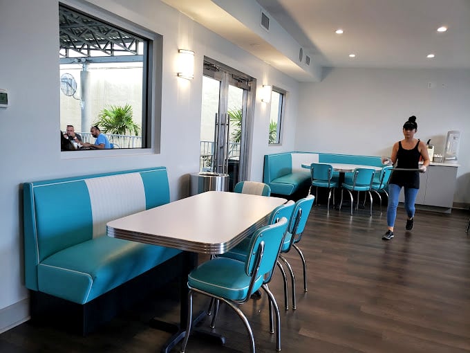 These turquoise booths aren't just seating—they're time machines to when diners were the heart of American social life and calories didn't count.